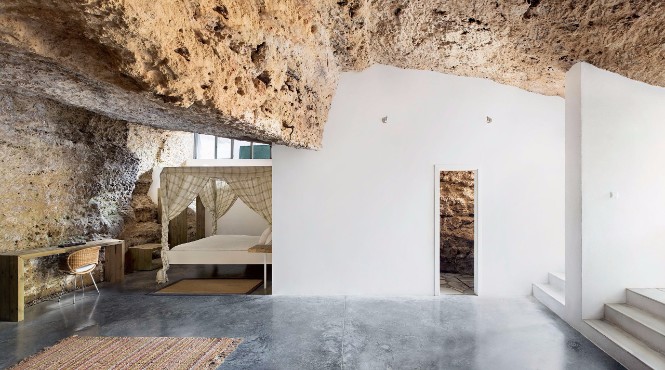 Cave House Straight Out of a Fairy Tale with a Stunning Arc Floor Lamp